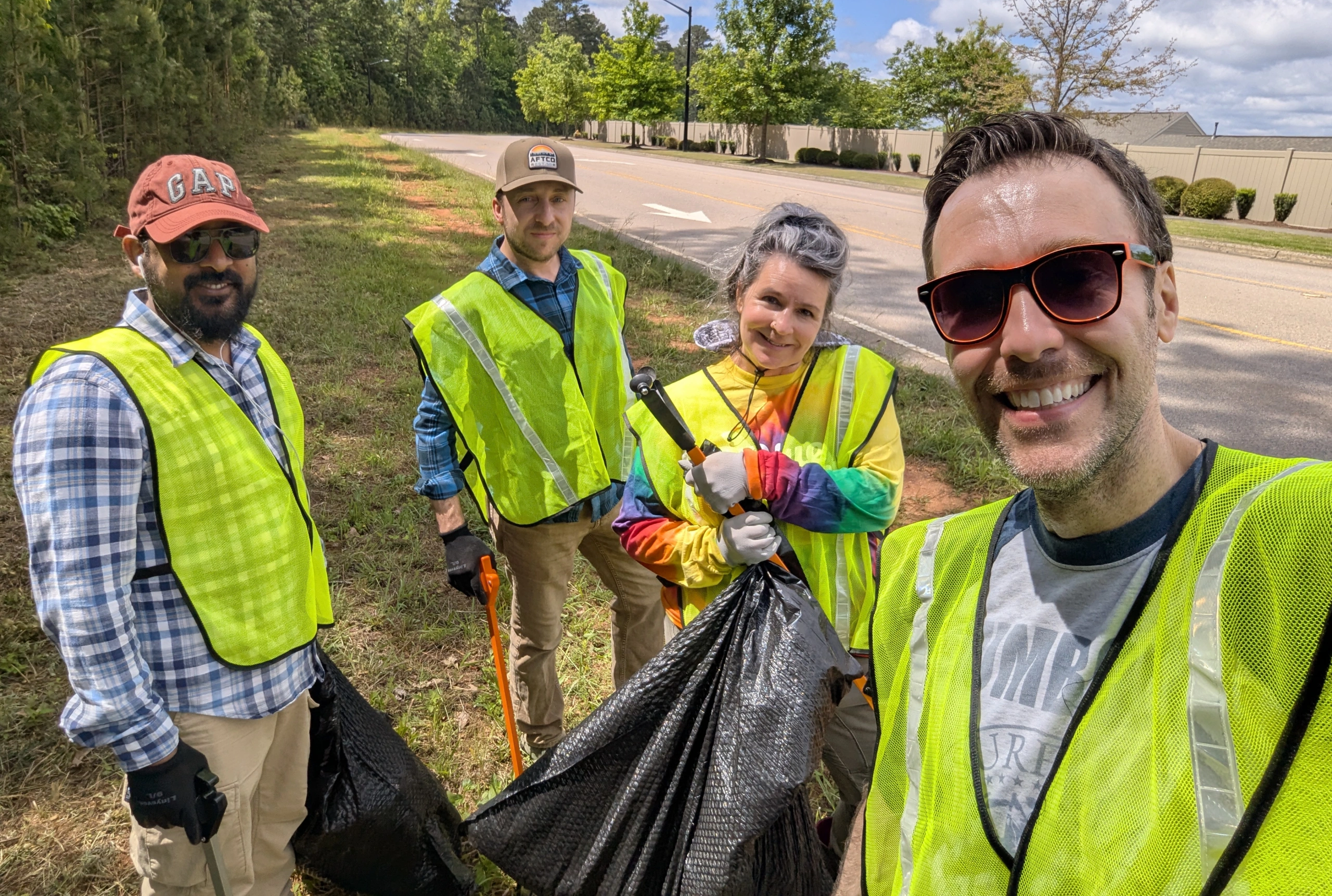 Team Members Volunteer to Clean Roads, Refurbish Computers and Build ...